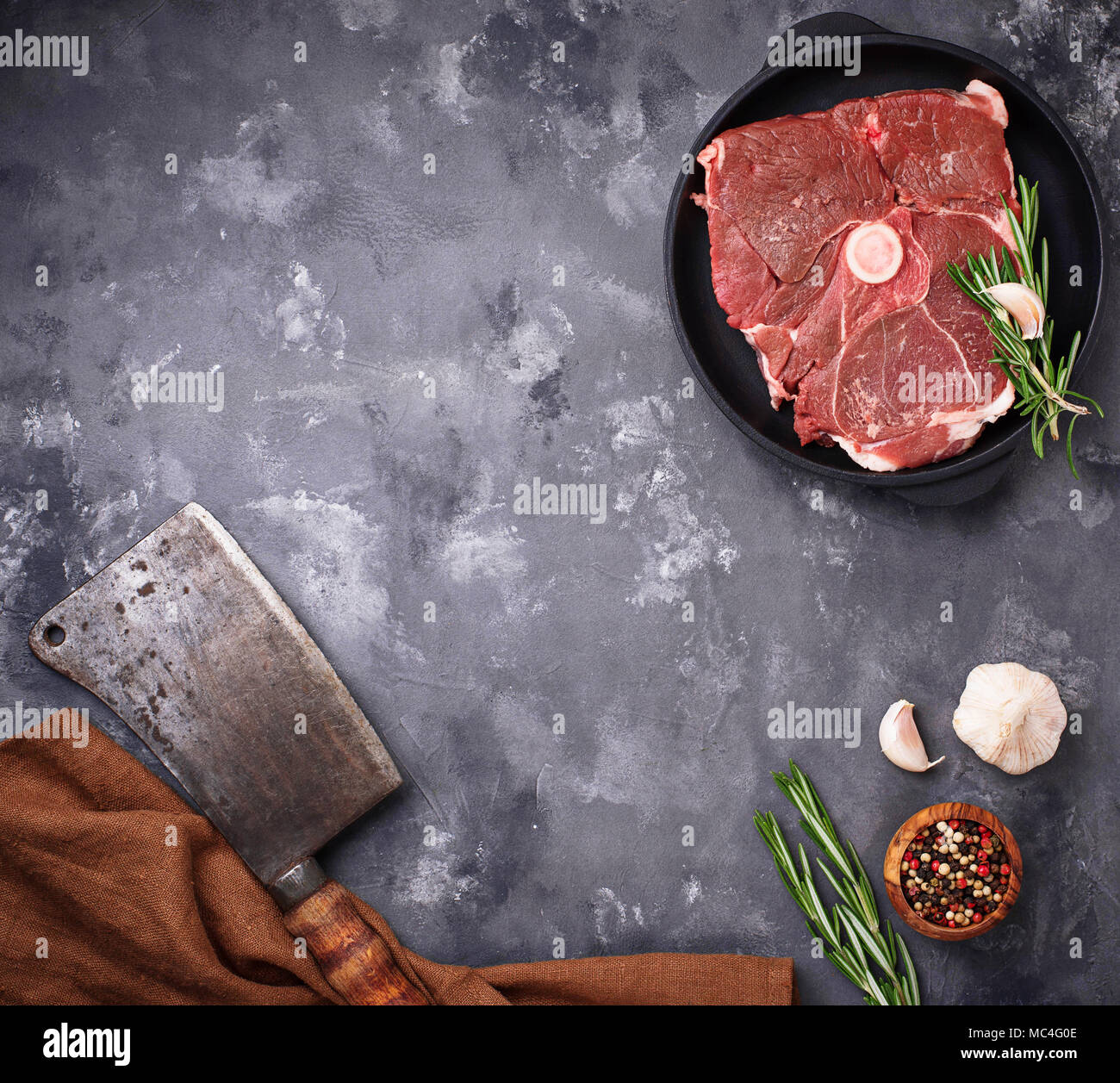 Lamb meat with rosemary, spices and cleaver Stock Photo - Alamy