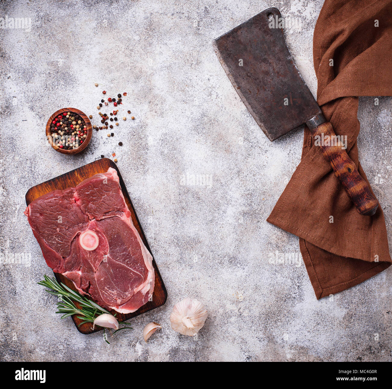 Lamb meat with rosemary, spices and cleaver Stock Photo - Alamy