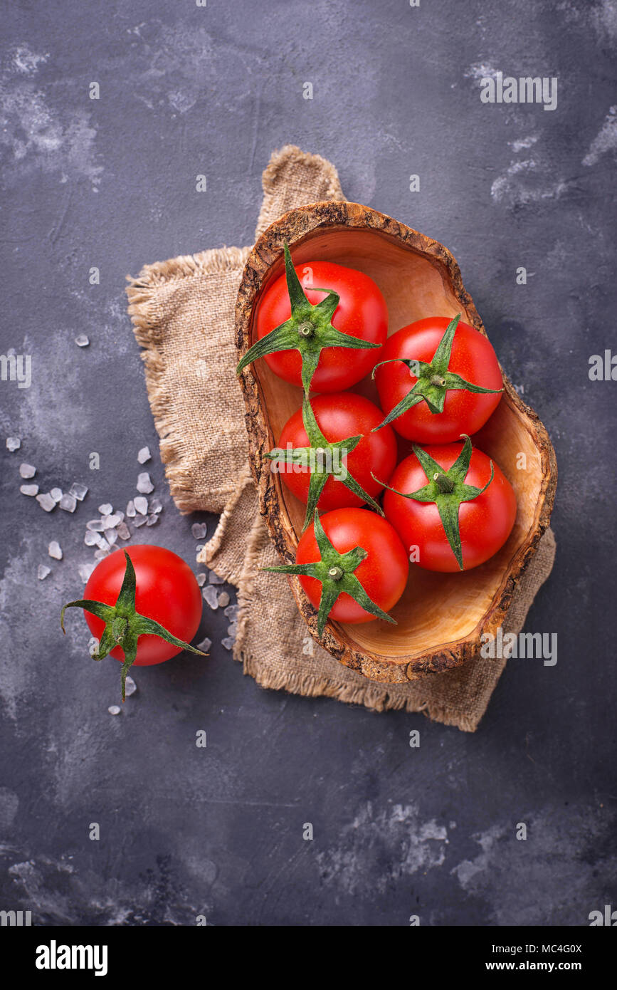 Fresh cherry tomatoes on grey table Stock Photo - Alamy