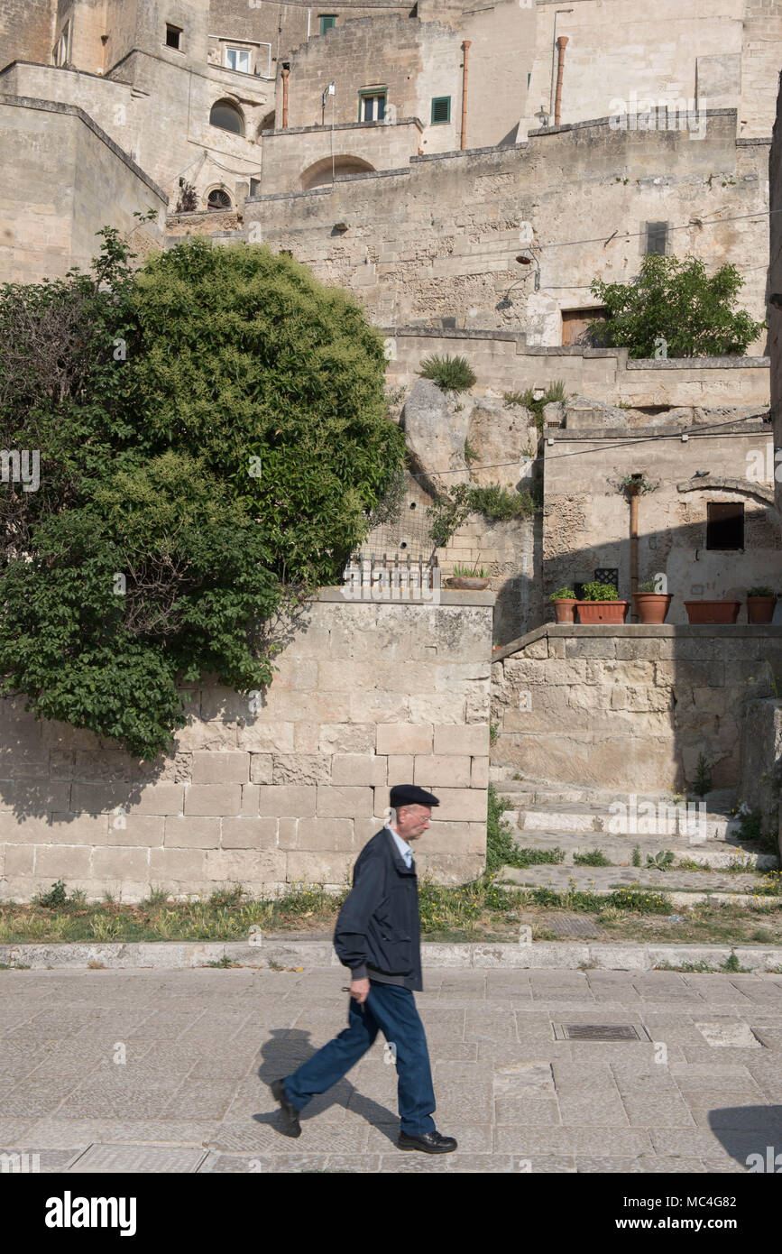 Old man with a typical look from southern Italy, walking along the ...