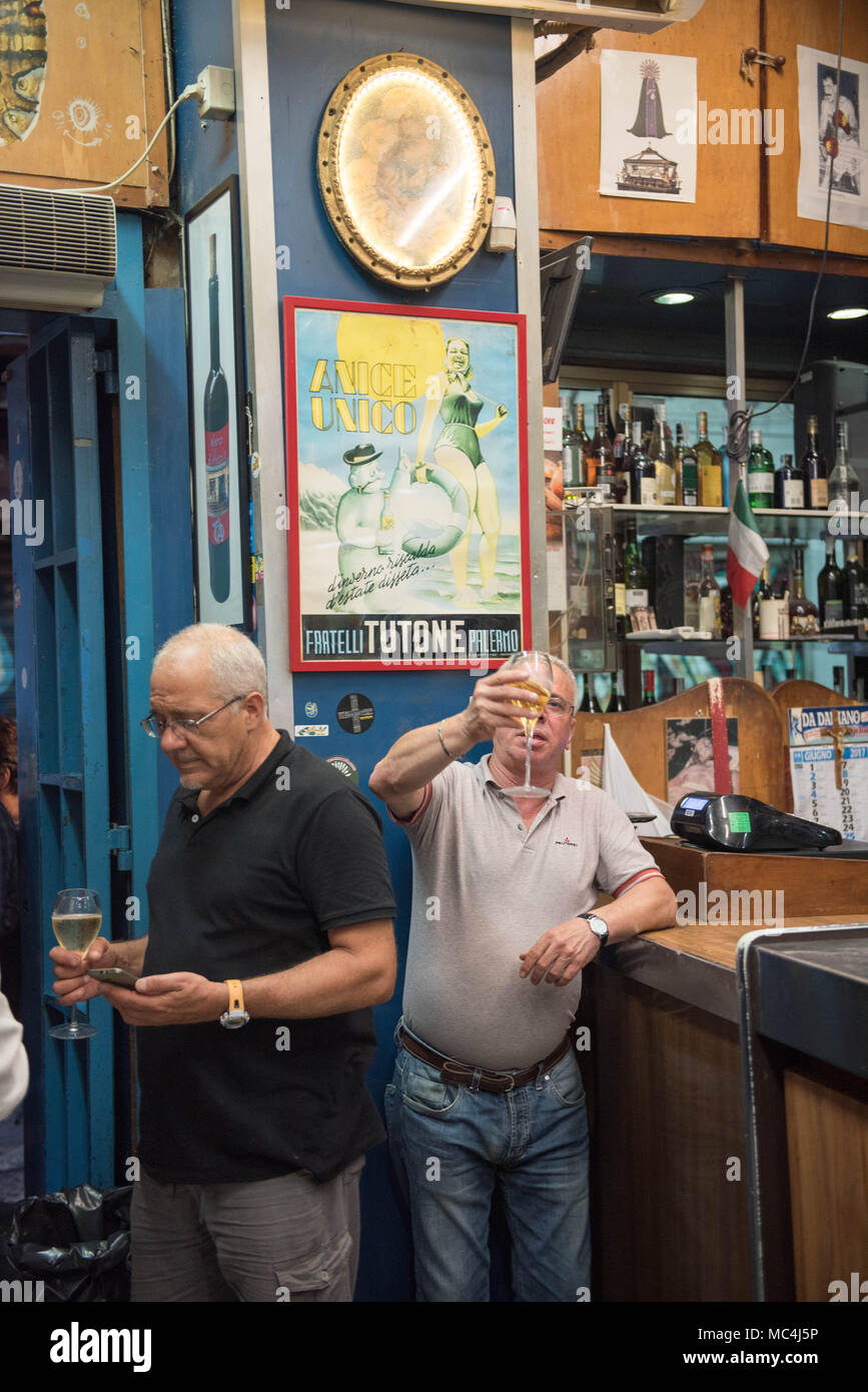 Evening in the Taverna Azzurra at the market of Vucciria, where alcohol ...