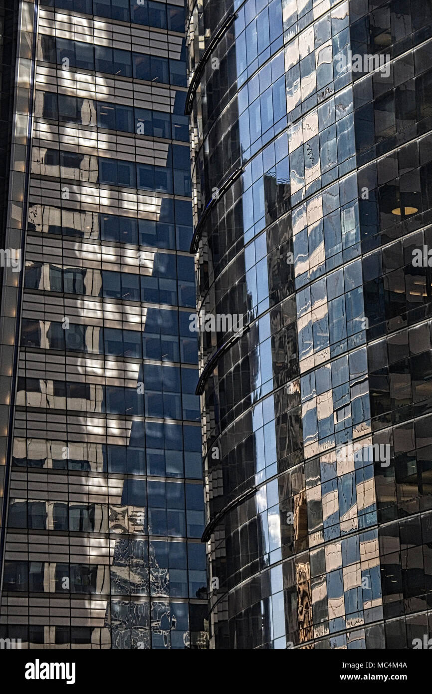 Contemporary glass and steel high-rise reflecting office buildings in ...