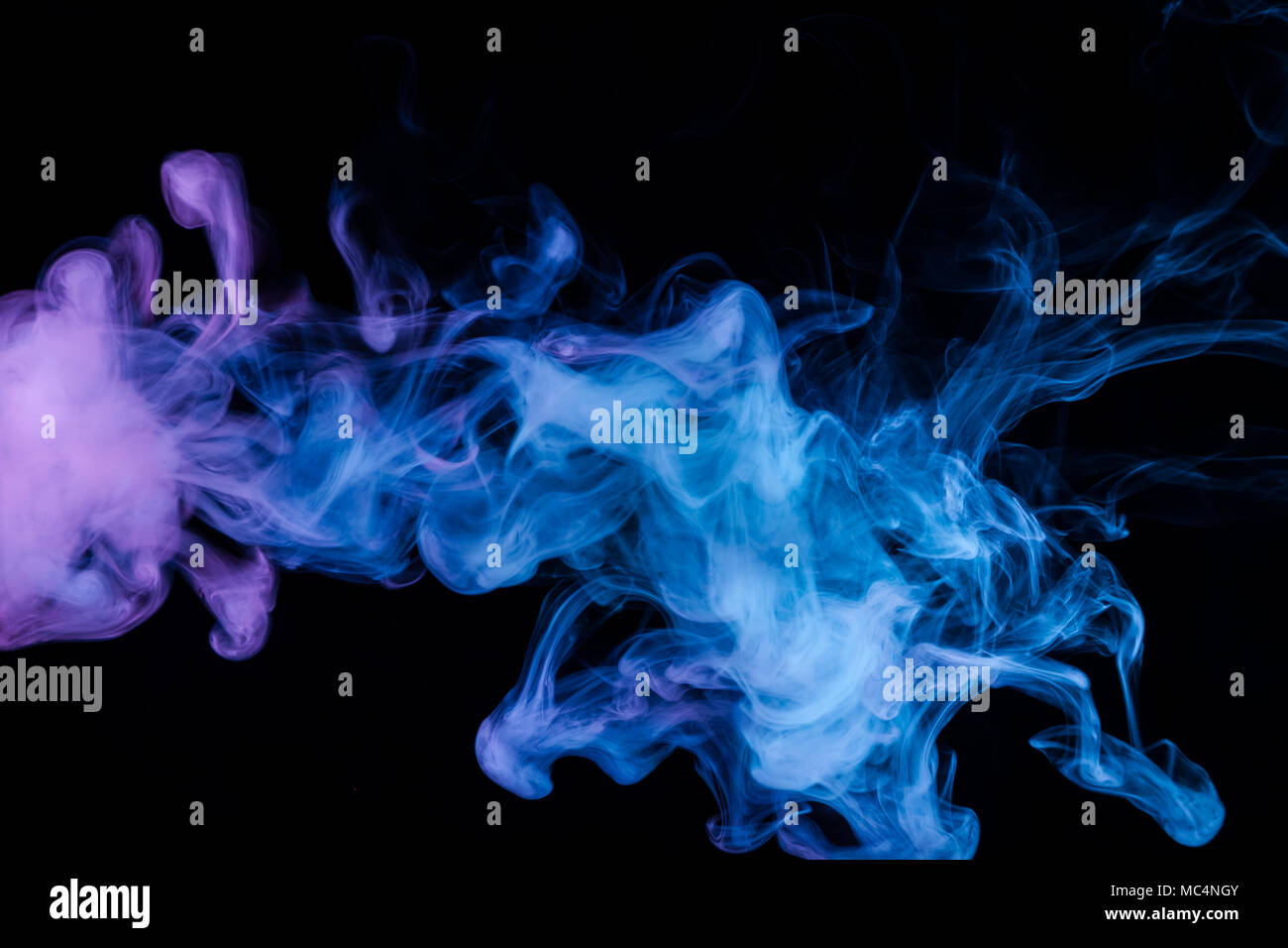 Colorful blue smoke on a black isolated background. Background from the ...