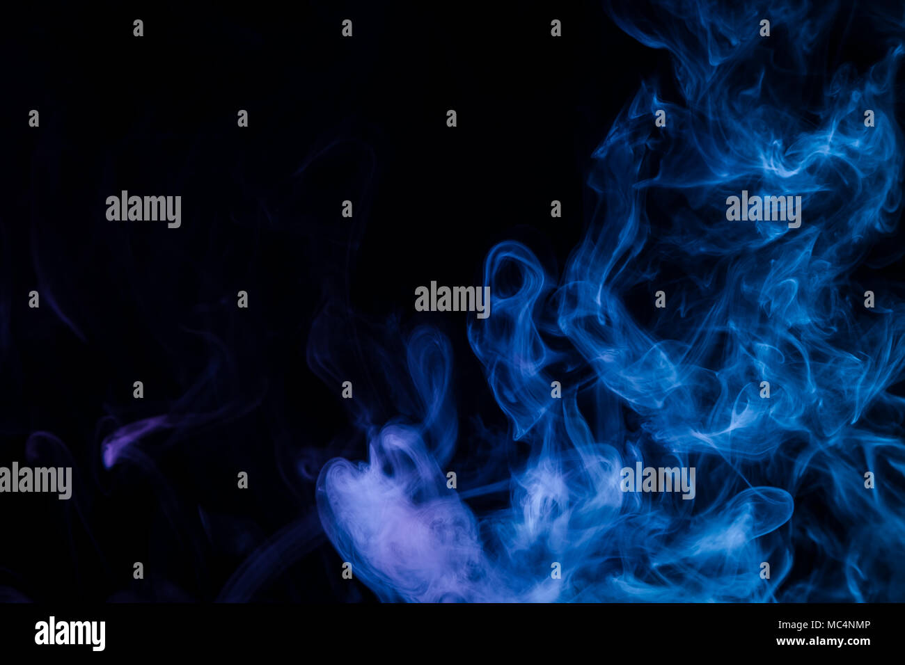 Blue smoke on black background Stock Photo - Alamy