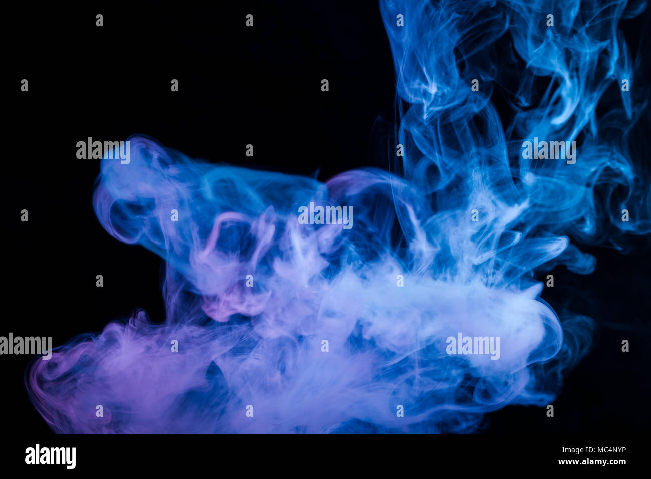 Colorful blue smoke on a black isolated background. Background from the ...
