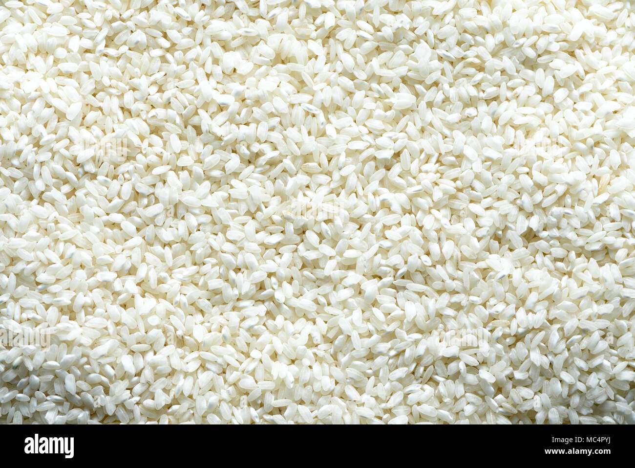 White raw organic basmati rice background. Food ingredient background ...