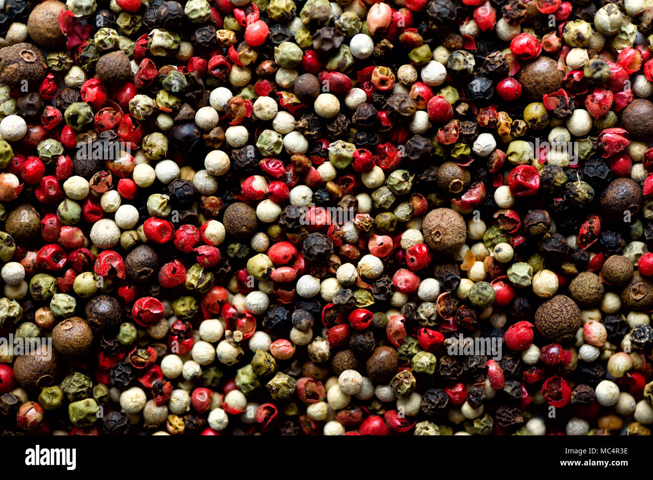 Pepper spice texture. Multicolored pepper corns, mix of colorful grains ...