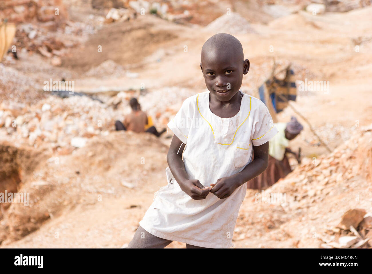 Lugazi, Uganda. June 18 2017. A smiling Ugandan boy standing in a ...