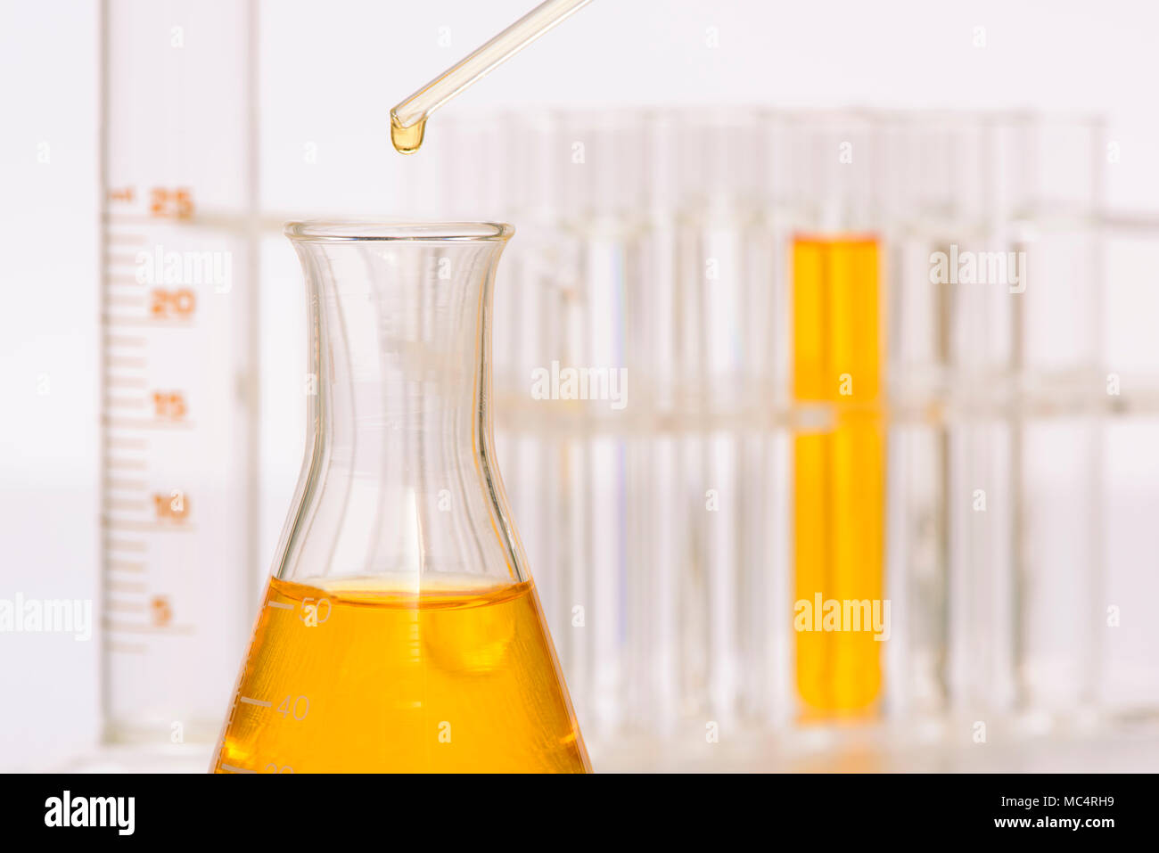 scientific experiment in chemistry laboratory with liquid in test tubes ...