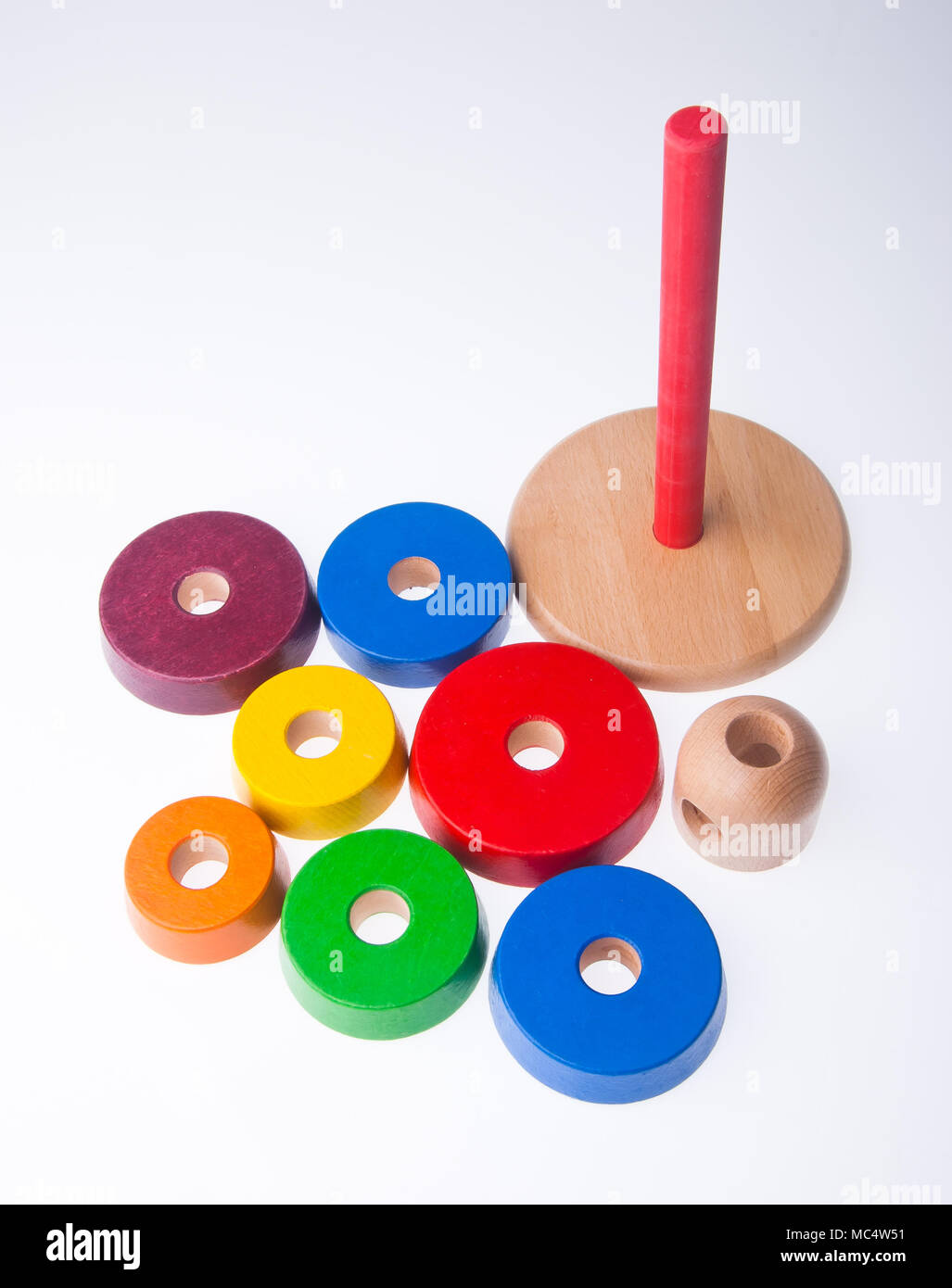 Baby toy. Learning child wood color pyramid toy Stock Photo - Alamy