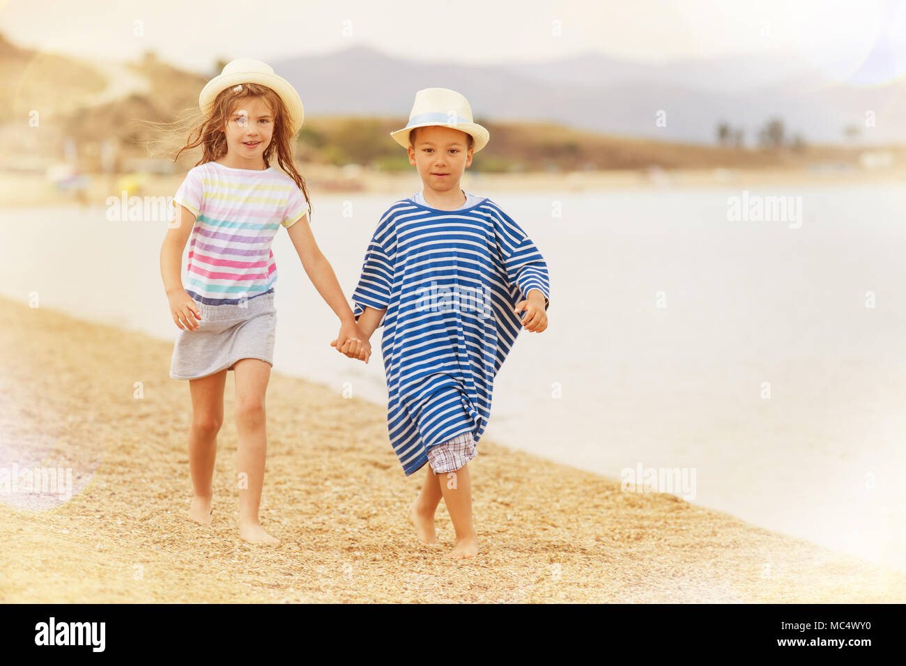 Happy kids at beach hi-res stock photography and images - Alamy