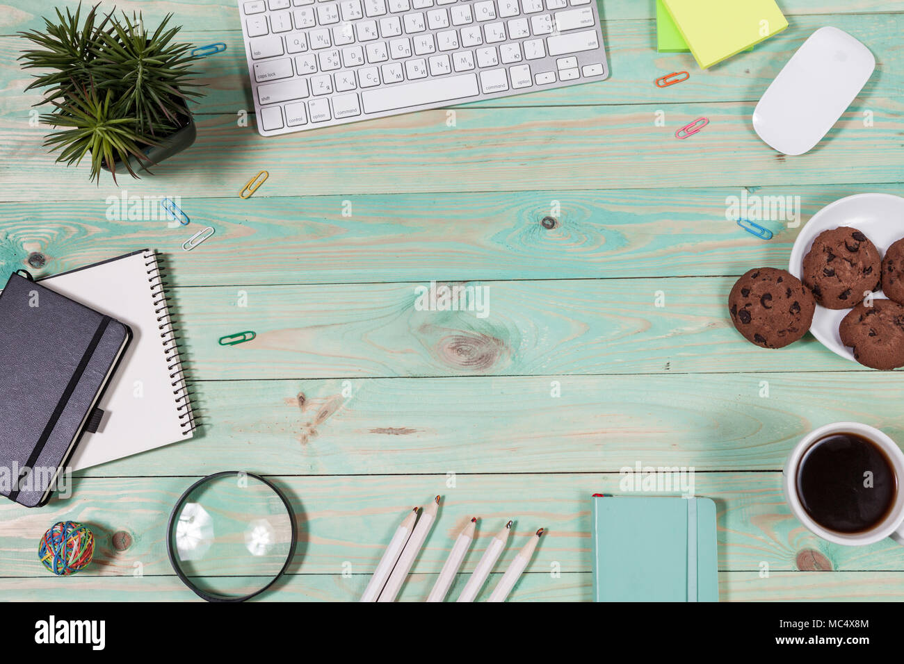 Blue office desk table with with office supplies. Top view with copy ...