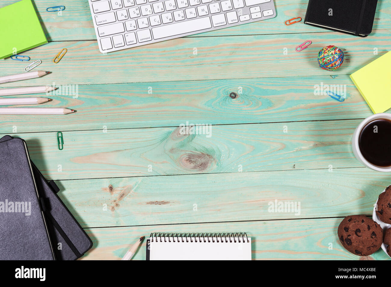 Blue office desk table with with office supplies. Top view with copy ...