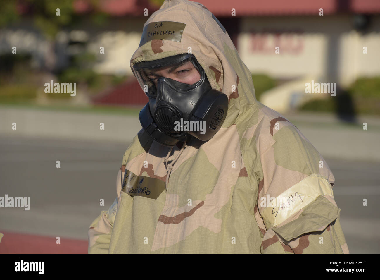 An Airman wearing Mission Oriented Protective Posture gear participates ...