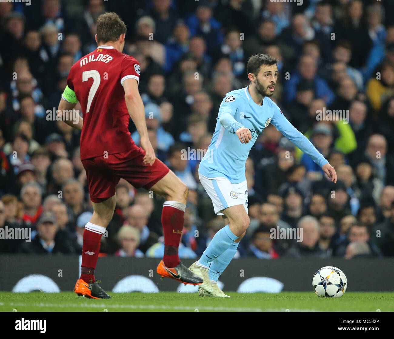 MANCHESTER, ENGLAND - APRIL 10: James Milner of Liverpool and Bernardo ...