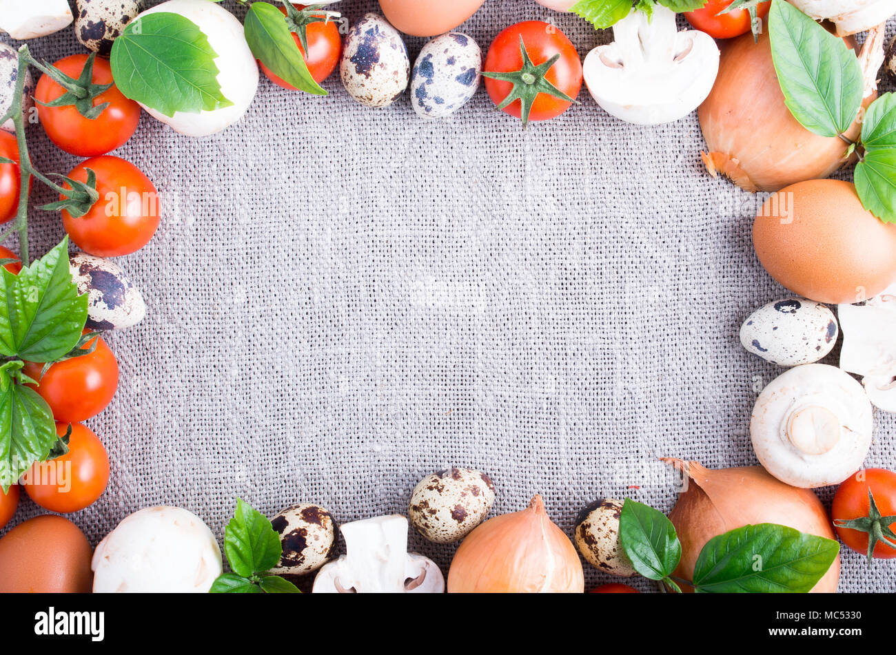 Organic products from the farm. Food ingredients on the gray burlap ...