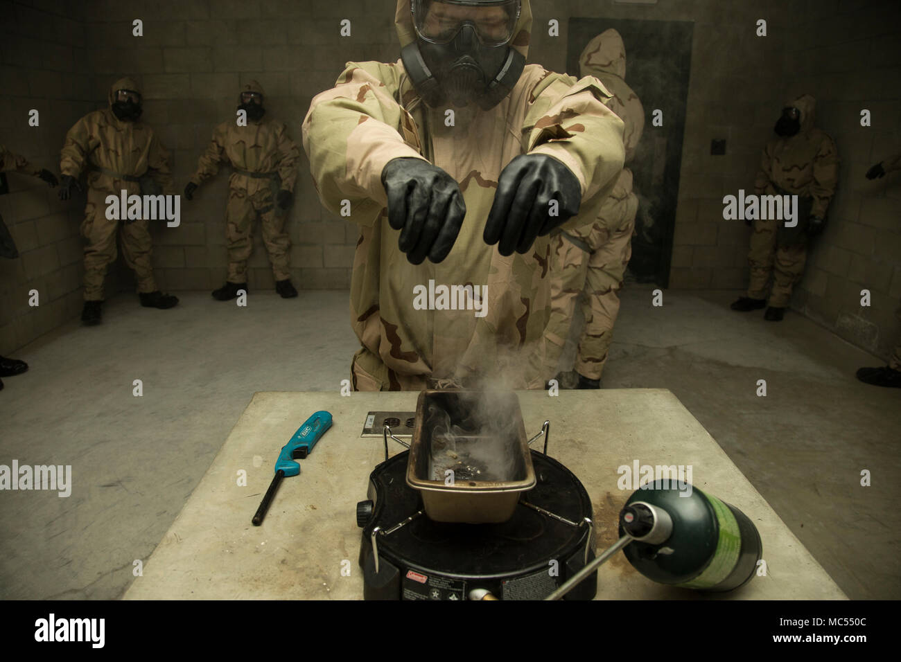U.S. Marine Corps Lance Cpl. Patrick Espanola, a chemical biological ...