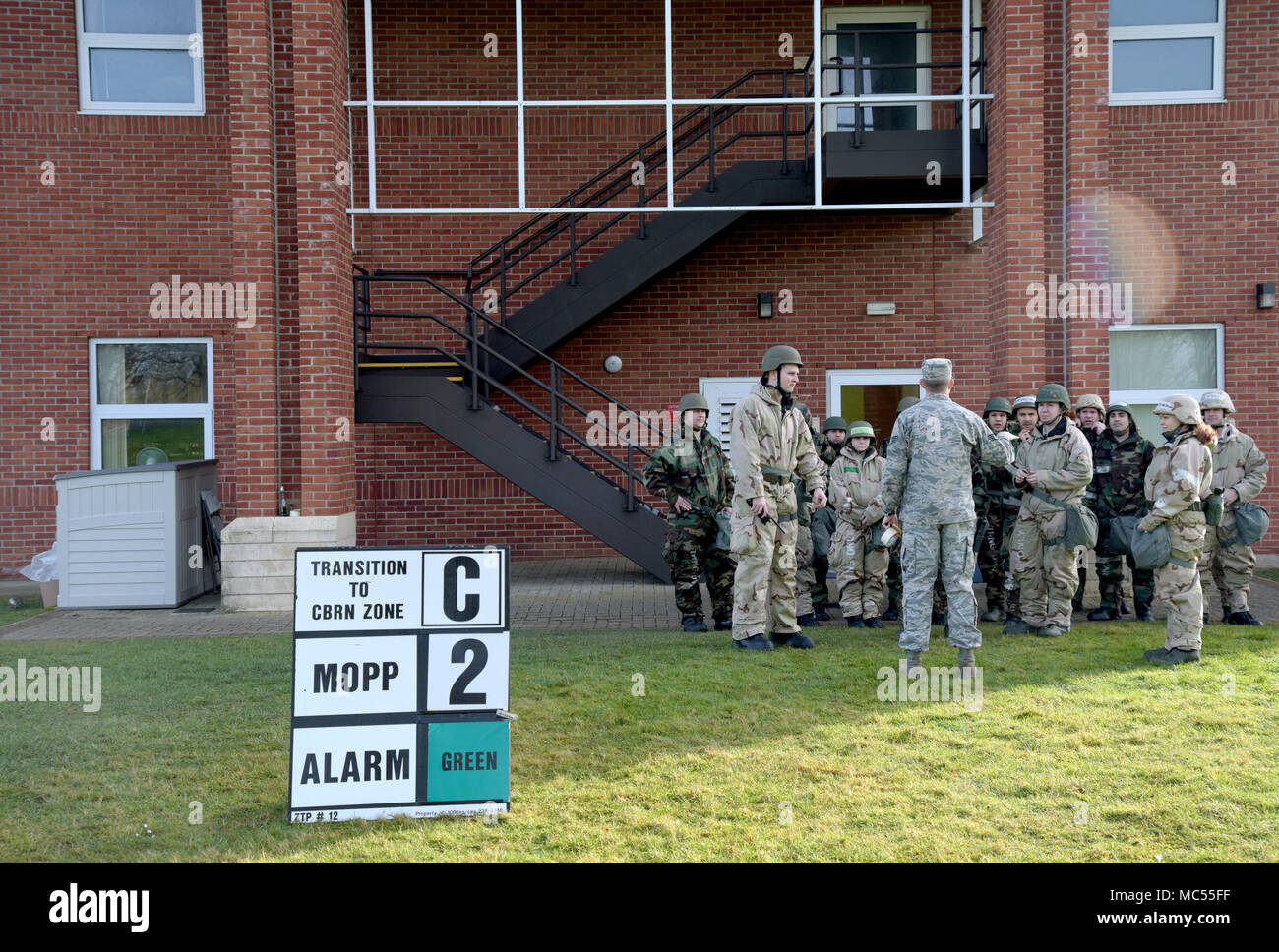 U.S. Airmen assigned to the 100th Air Refueling Wing listen to an ...
