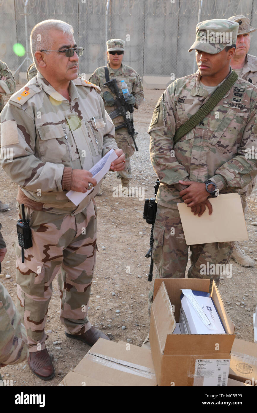 An Iraqi officer and U.S. Army Sgt. Chadwick Dile assigned to the 536th ...