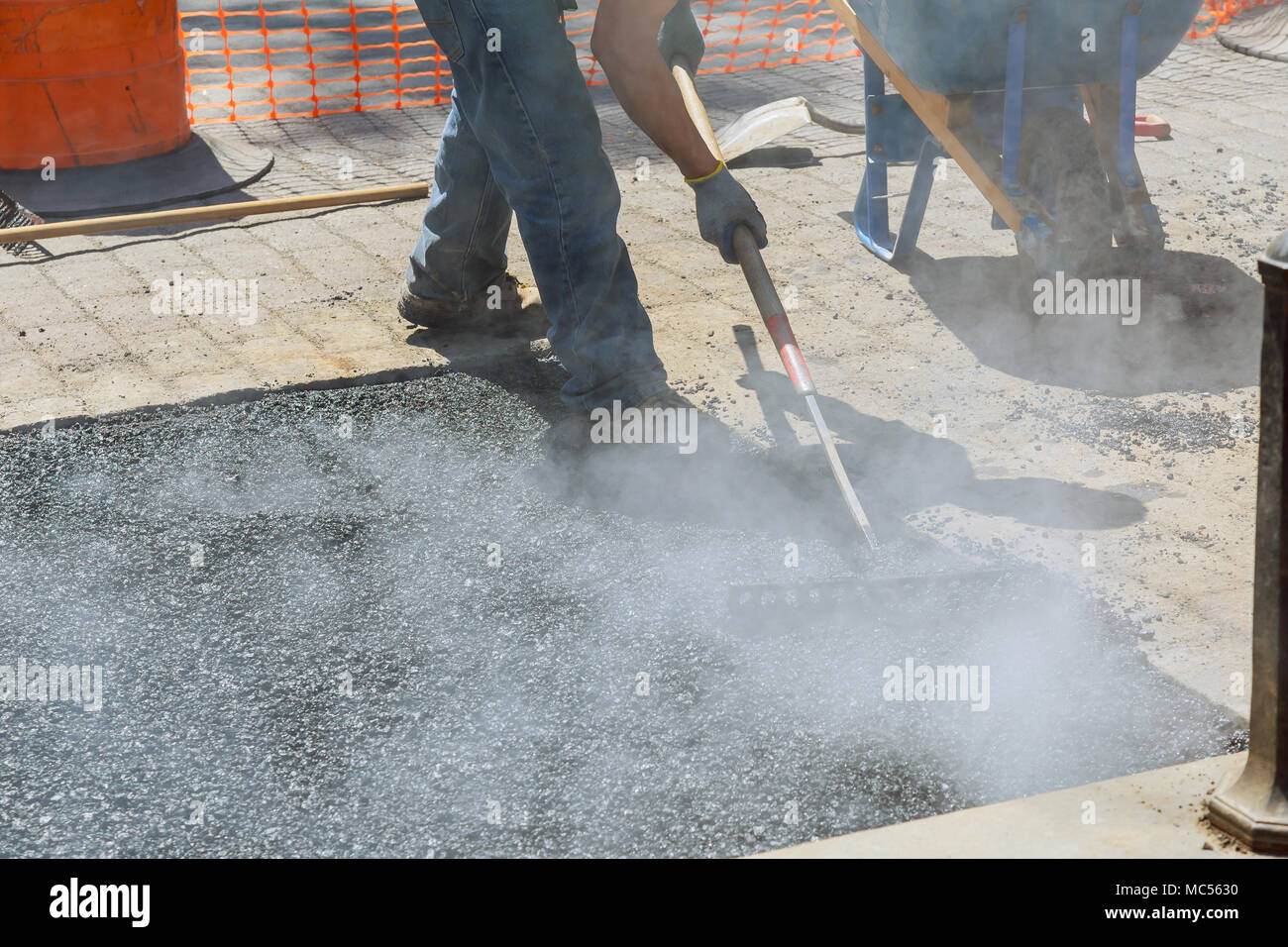 teamwork, new asphalt workers on a road construction, industry and Road ...
