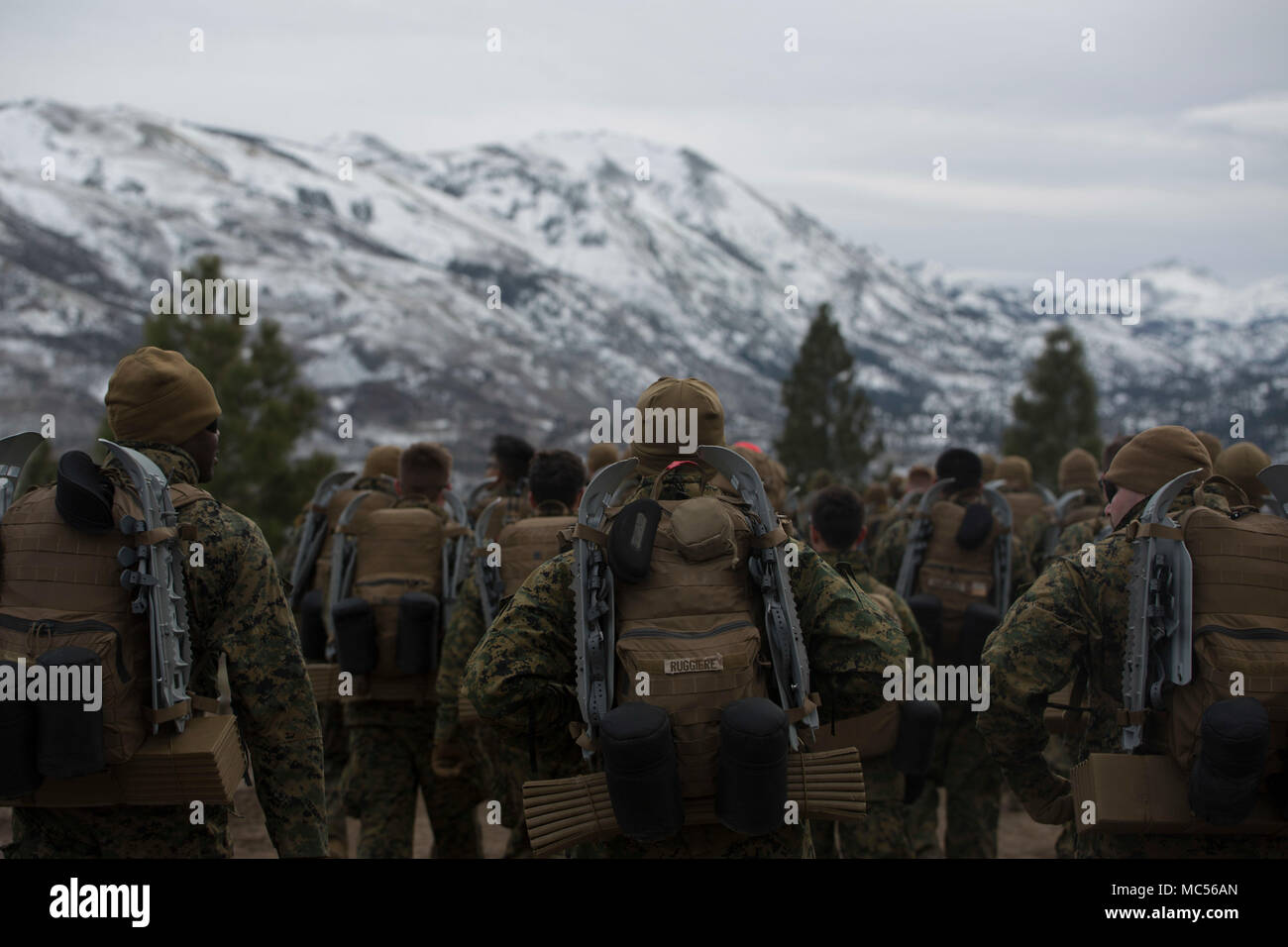 Marines with Task Force Arctic Edge traverse a mountain during a ...