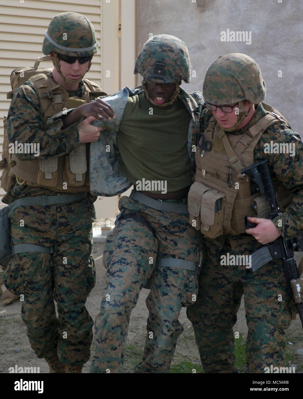 Lance Cpl. Gavin Richebourg, center, a rifleman with the 13th Marine ...