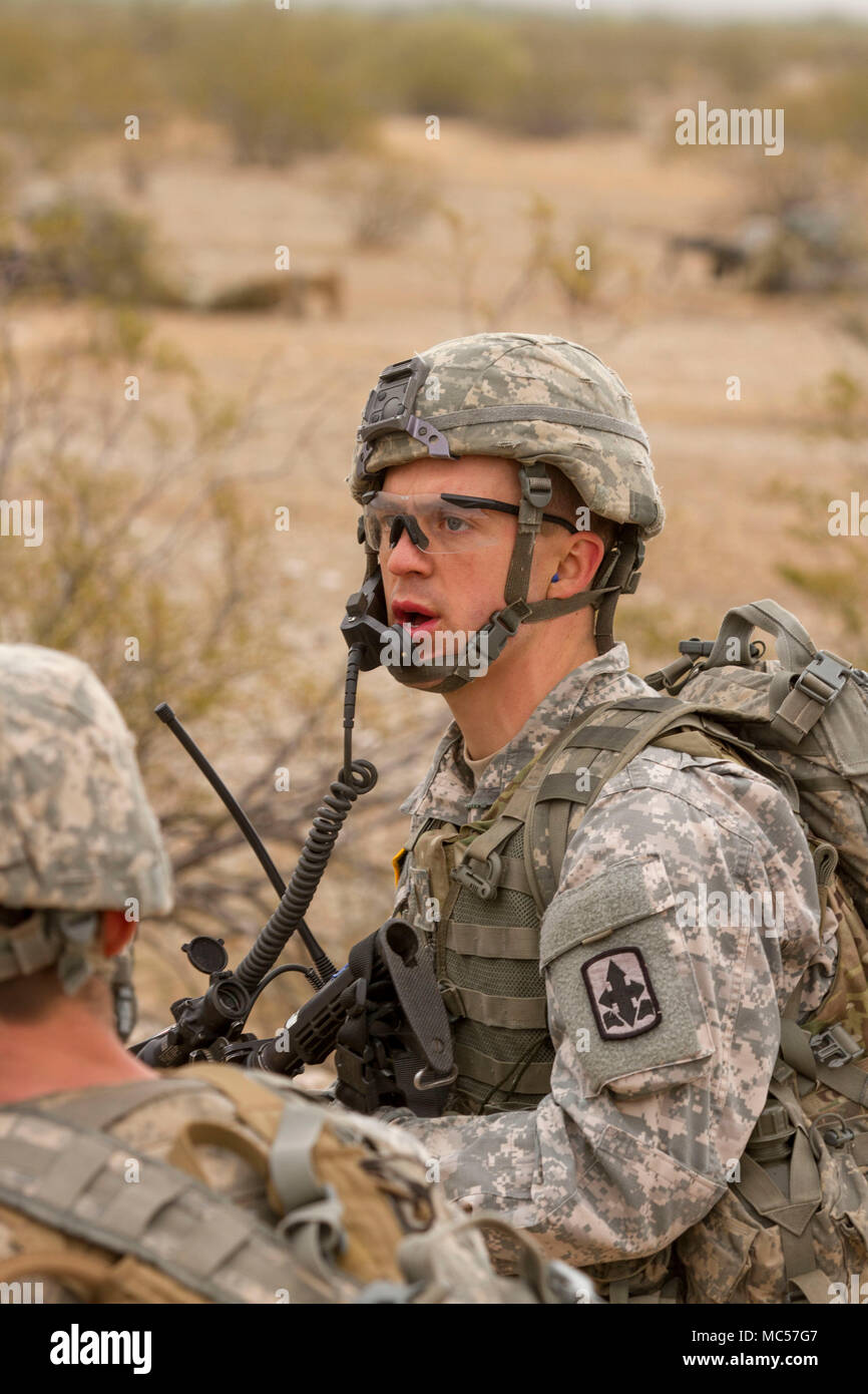 A platoon leader with 1st Battalion, 158th Infantry Regiment calls in a ...