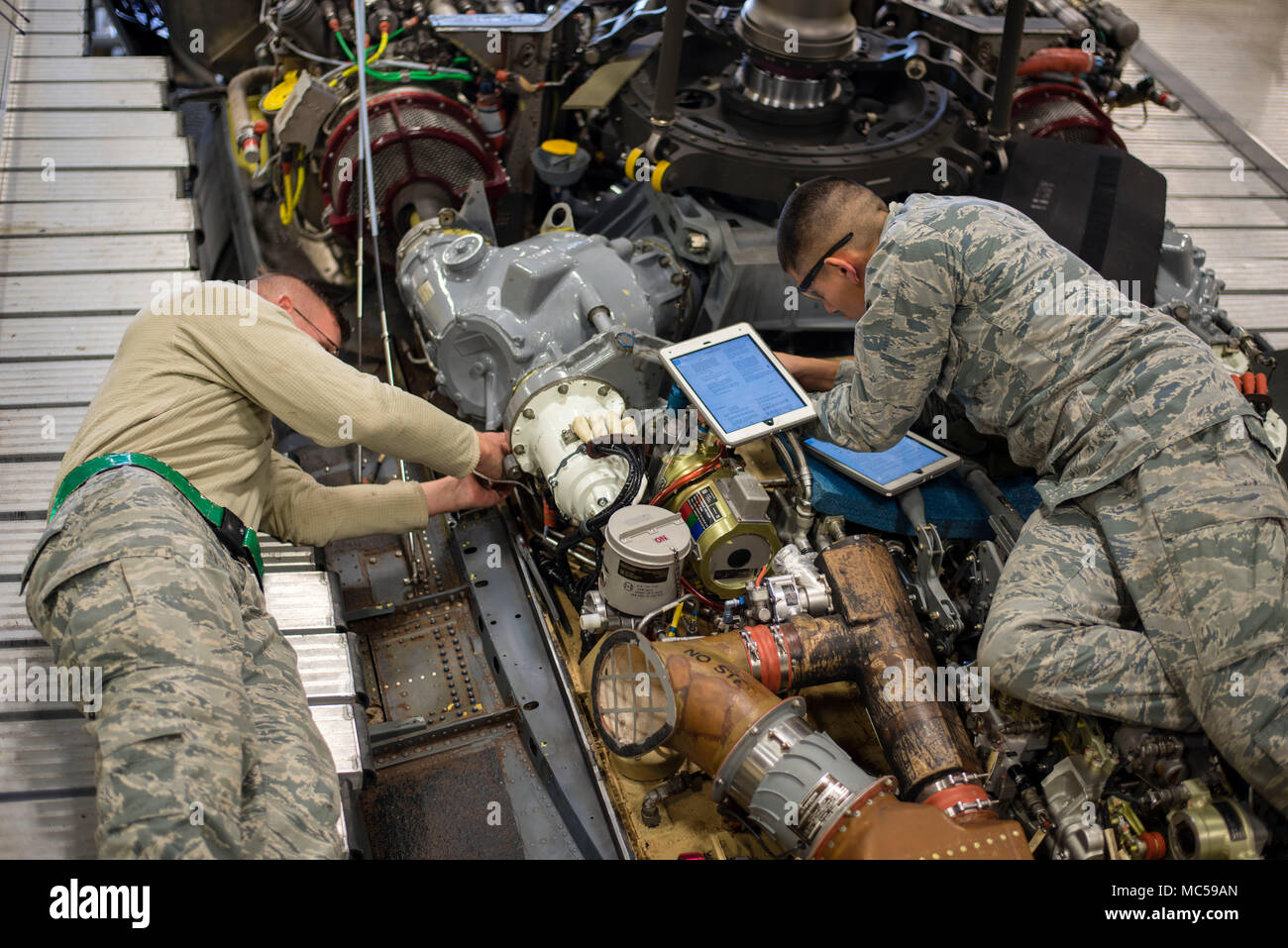 U.S. Air Force HH-60 Pavehawk crew chiefs from the 33rd Helicopter ...