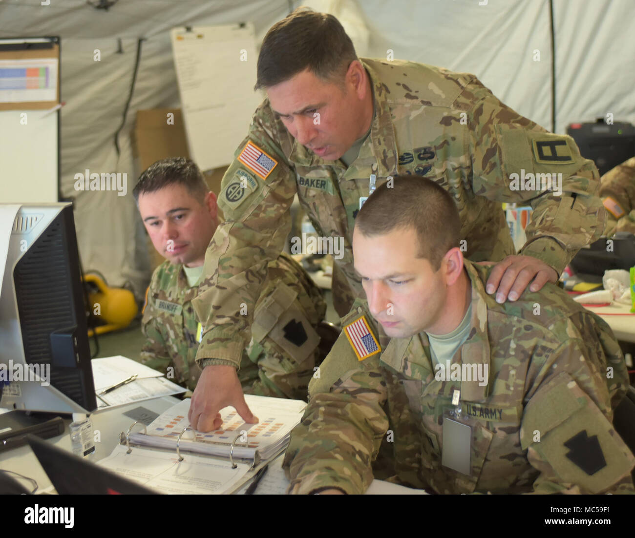 Lt. Col. William Baker (standing), a medical observer coach/trainer ...