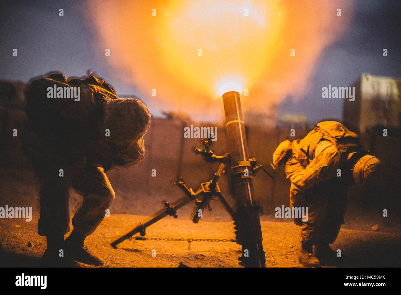U.S. Marines with Task Force Southwest fire a 120mm mortar in support ...