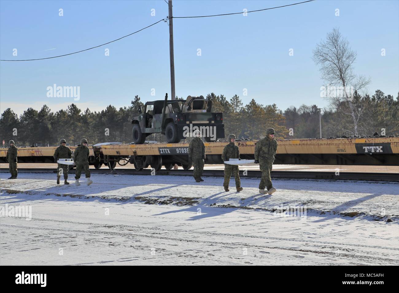 Marines with Marine Wing Support Squadron (MWSS) 271 load equipment on ...