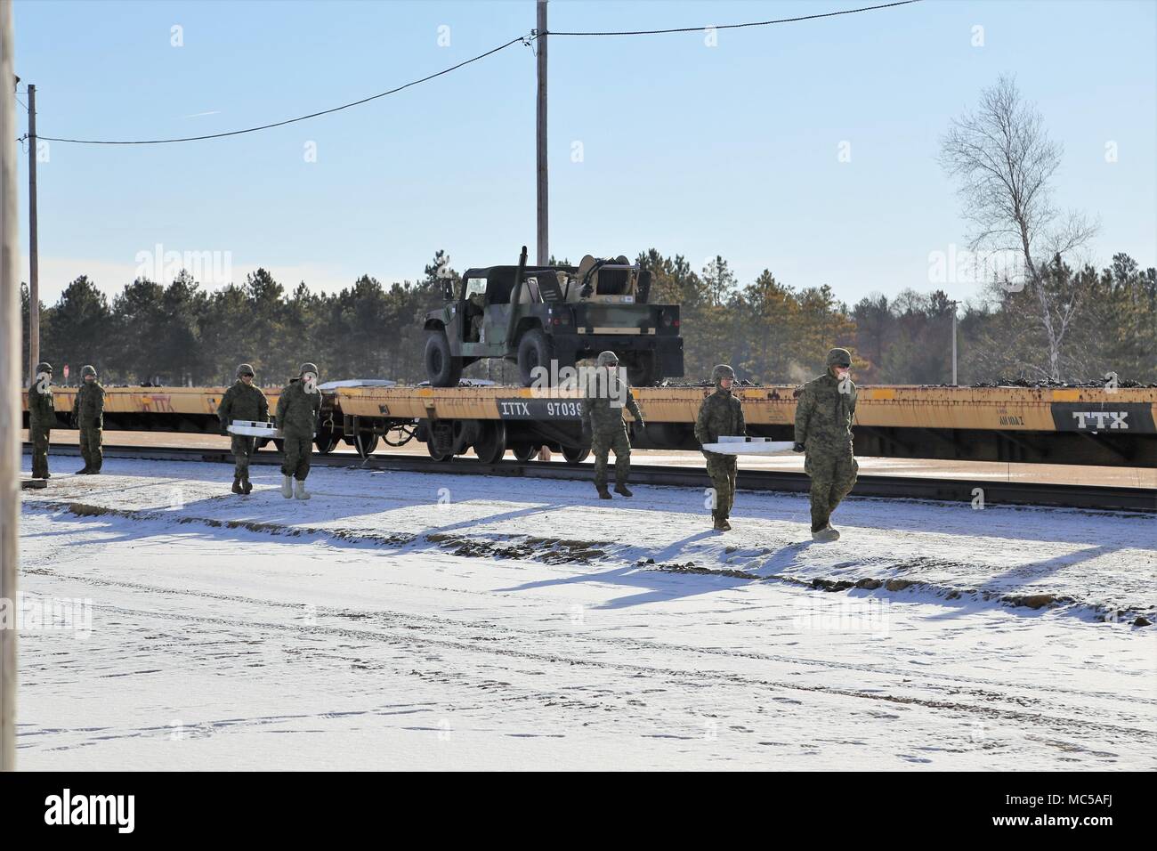 Marines with Marine Wing Support Squadron (MWSS) 271 load equipment on ...