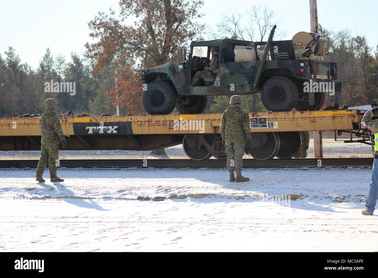 Marines with Marine Wing Support Squadron (MWSS) 271 load equipment on ...