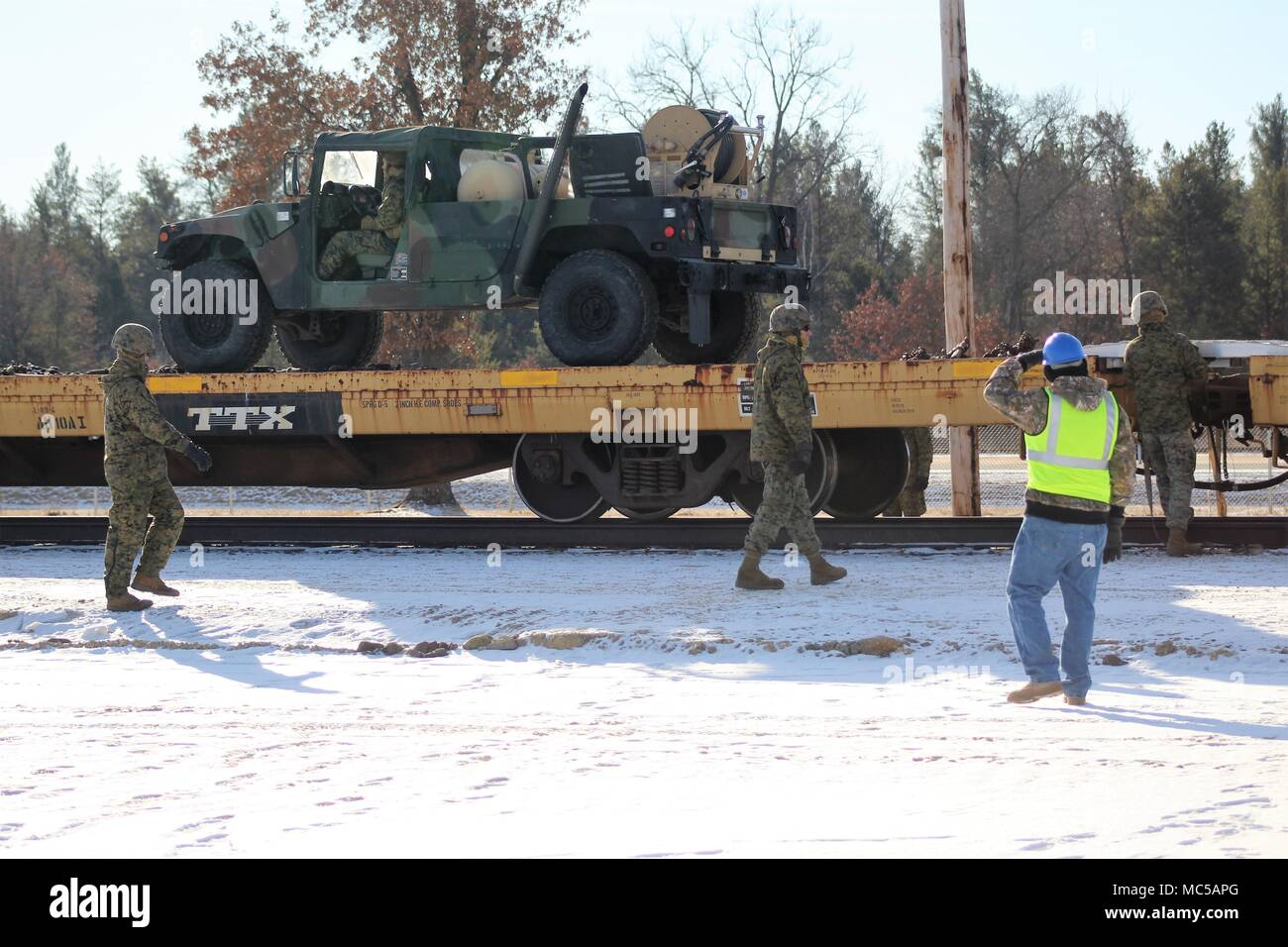 Marines with Marine Wing Support Squadron (MWSS) 271 load equipment on ...