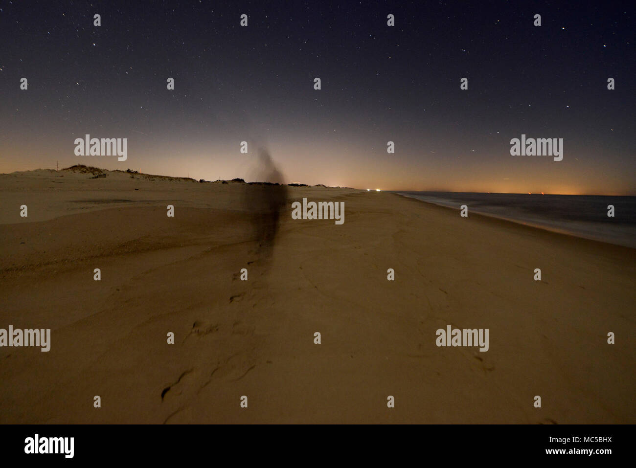 In this photo illustration, a Coast Guard member re-creates a nighttime ...