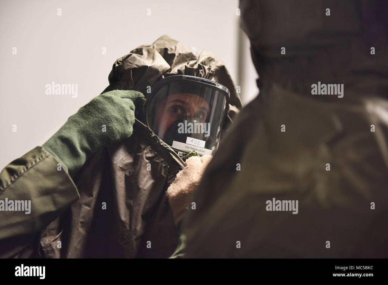 Maj. Megan Cooper, 12th Airborne Command and Control Squadron, puts on ...