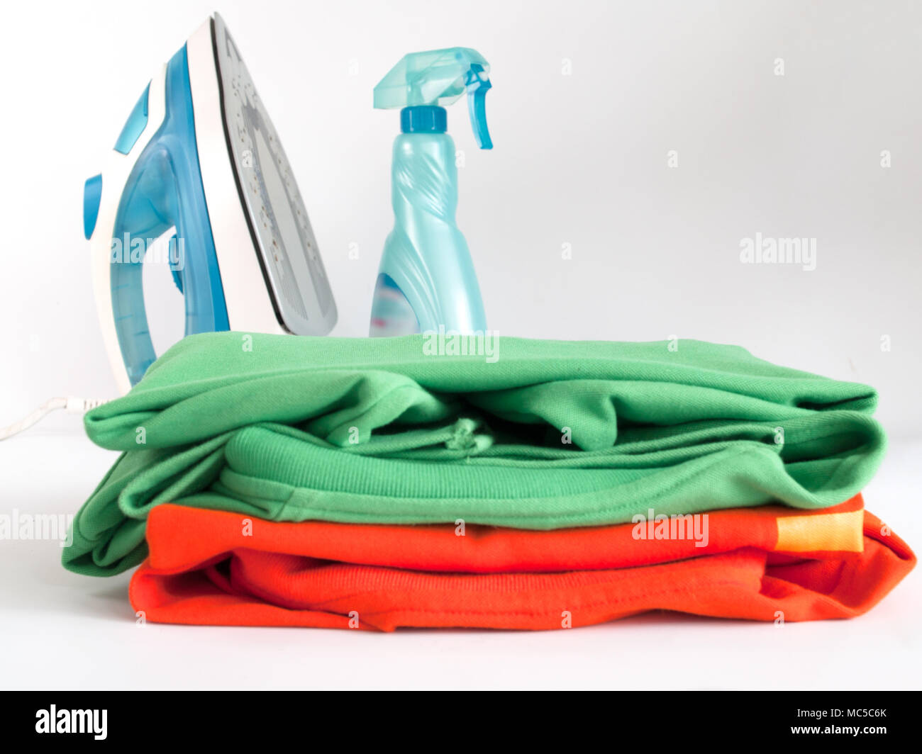 Ironing smoothing , with irons , Preparing clothes to be used daily ...