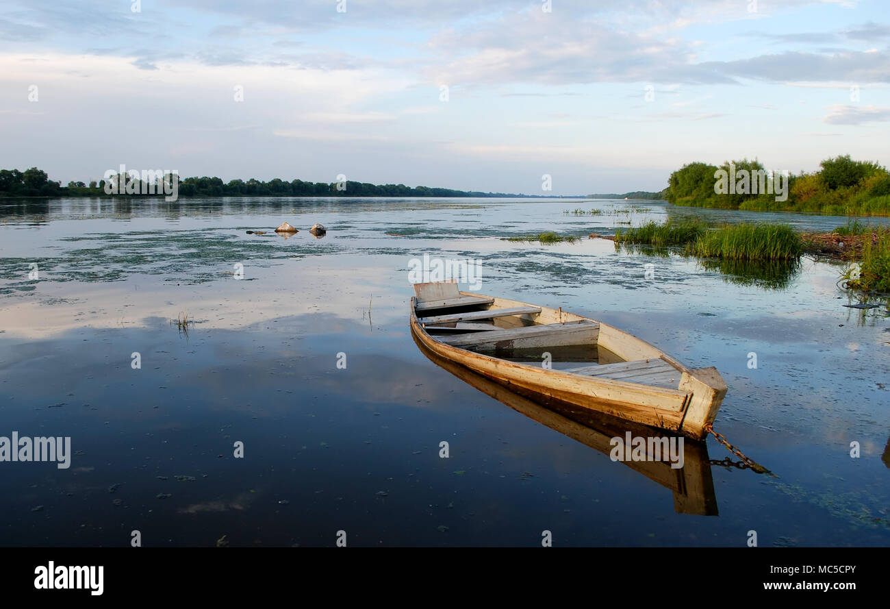 Old flooded wooden boat on river. The sunk boat Stock Photo - Alamy