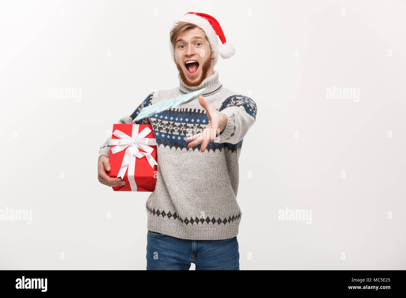 Santa claus throwing gift hi-res stock photography and images - Alamy