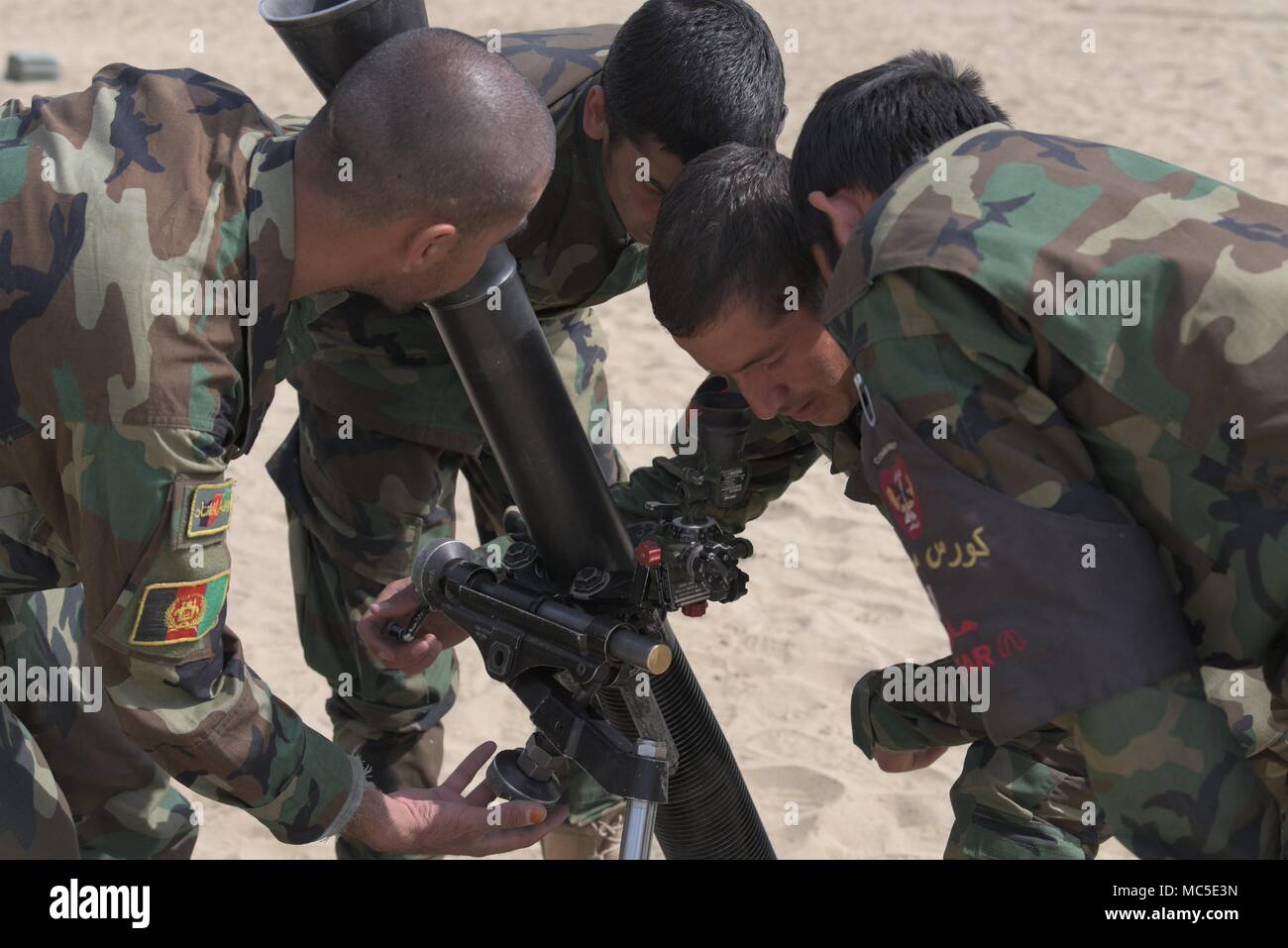 Afghan National Army Special Operations Corps Commandos adjust the ...