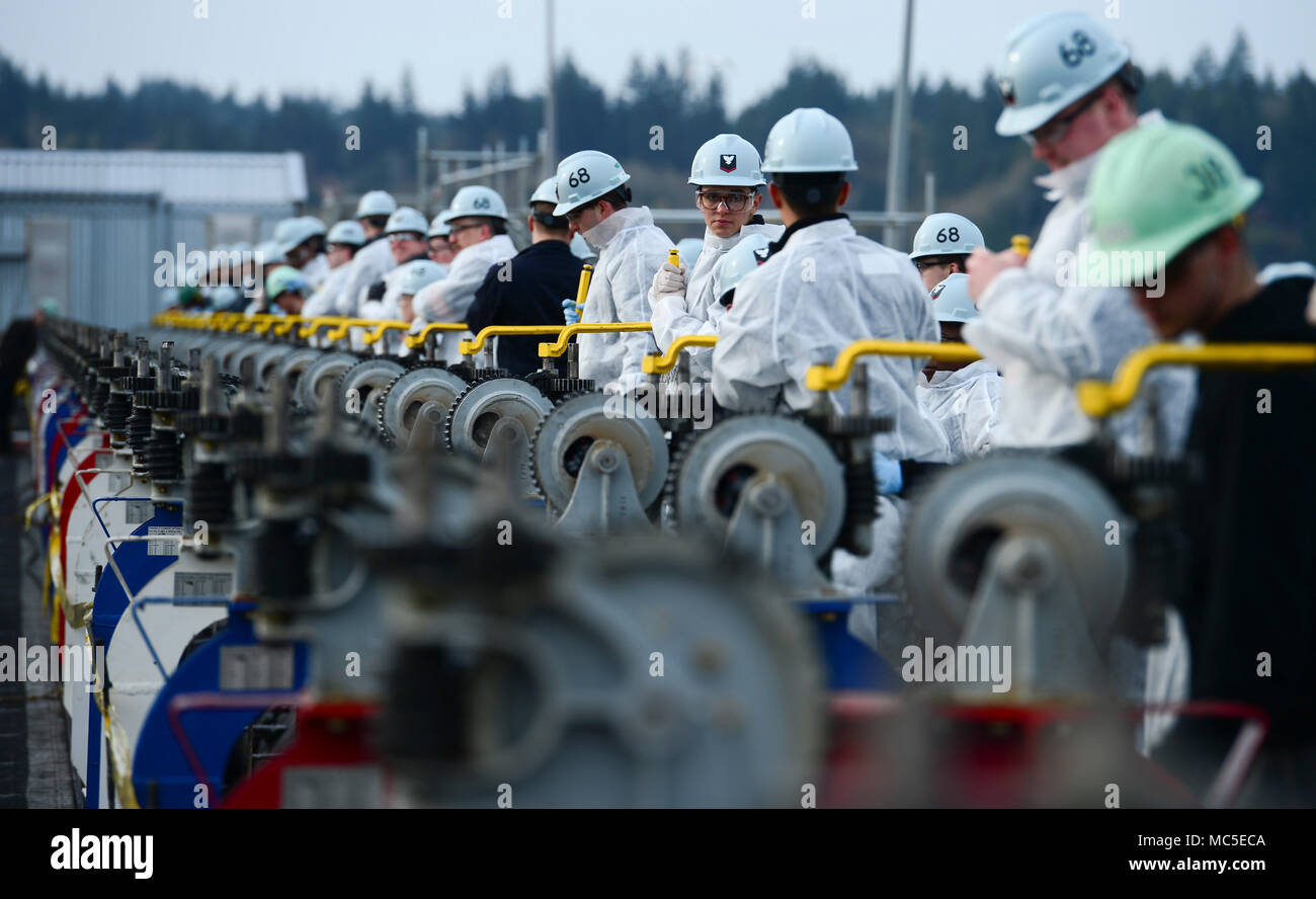 NAVAL BASE KITSAP-BREMERTON, Wash. (April 03, 2018) Sailors remove a ...
