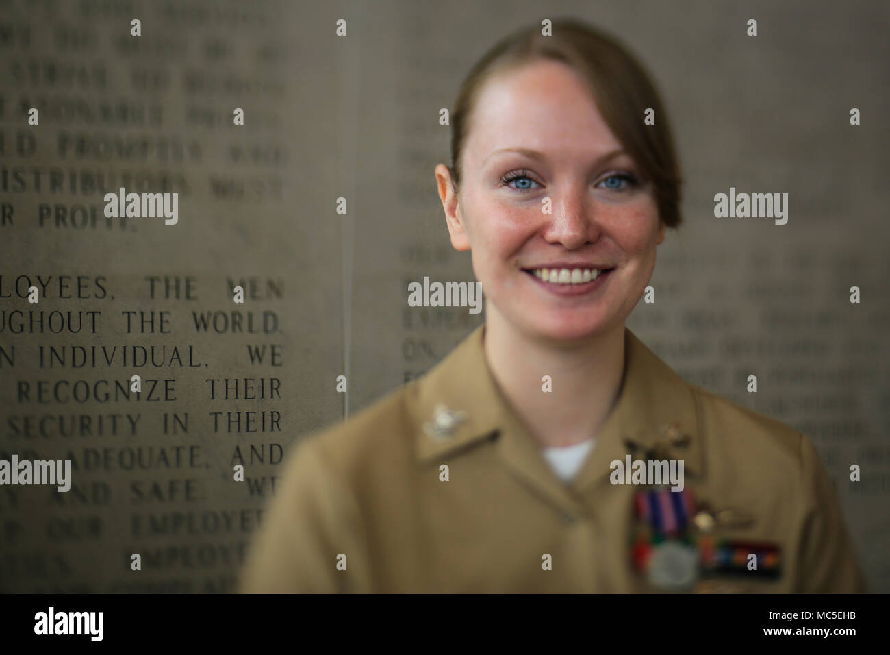 U.S. Navy EN2 Erin Wimmer stands for a portrait after receiving an ...