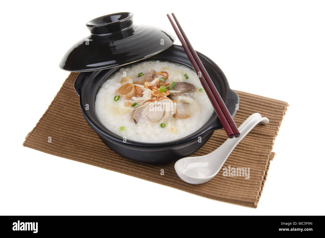 Porridge, abalone & chicken Porridge (congee) served in claypot Stock ...