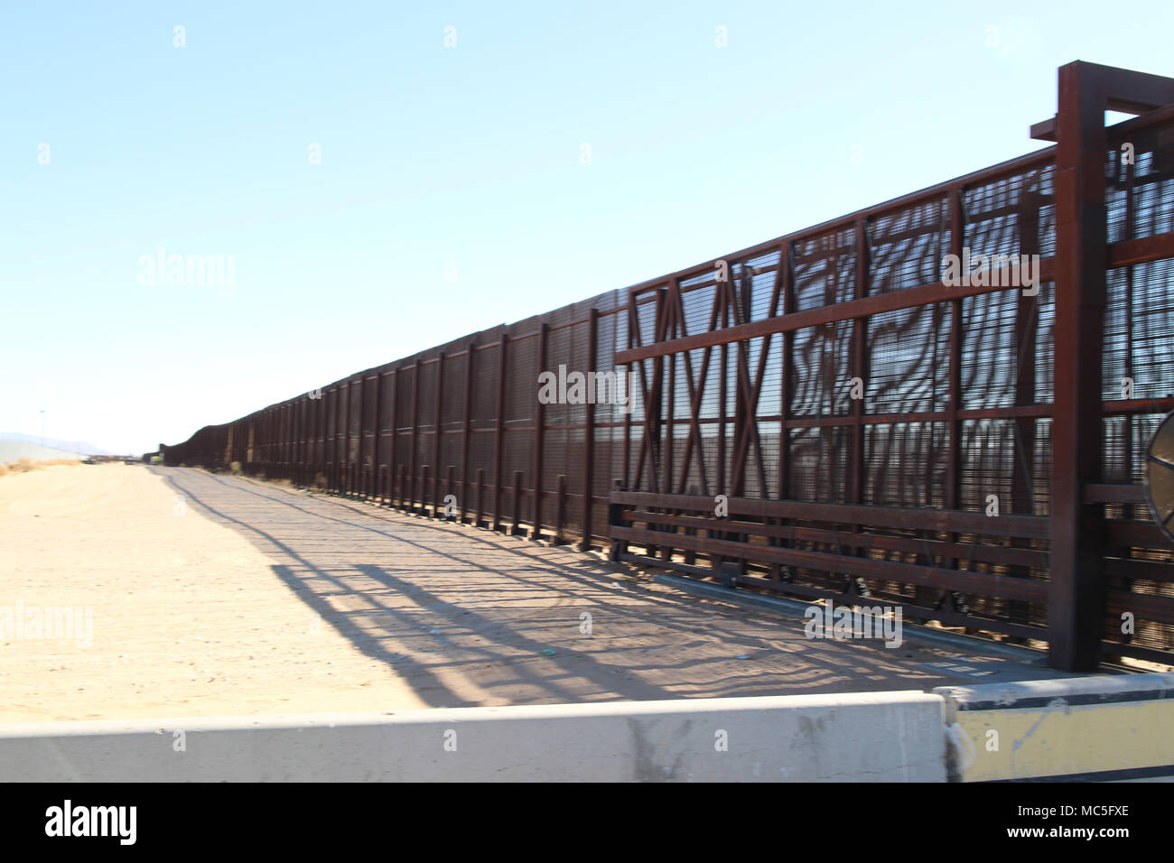 Imagery showing the current wire mesh barrier on the U.S.-Mexico border ...