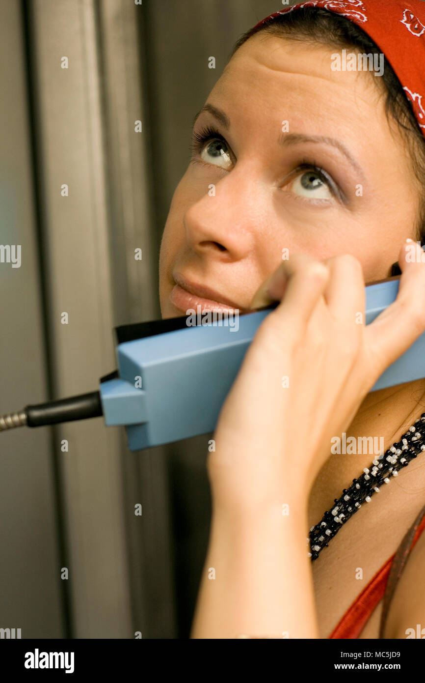 Beautiful girl red telephone on hi-res stock photography and images - Alamy