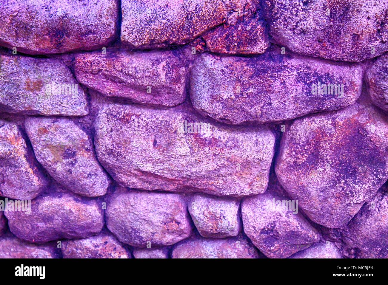 Violet Stone wall for background or rocks rough texture Stock Photo - Alamy