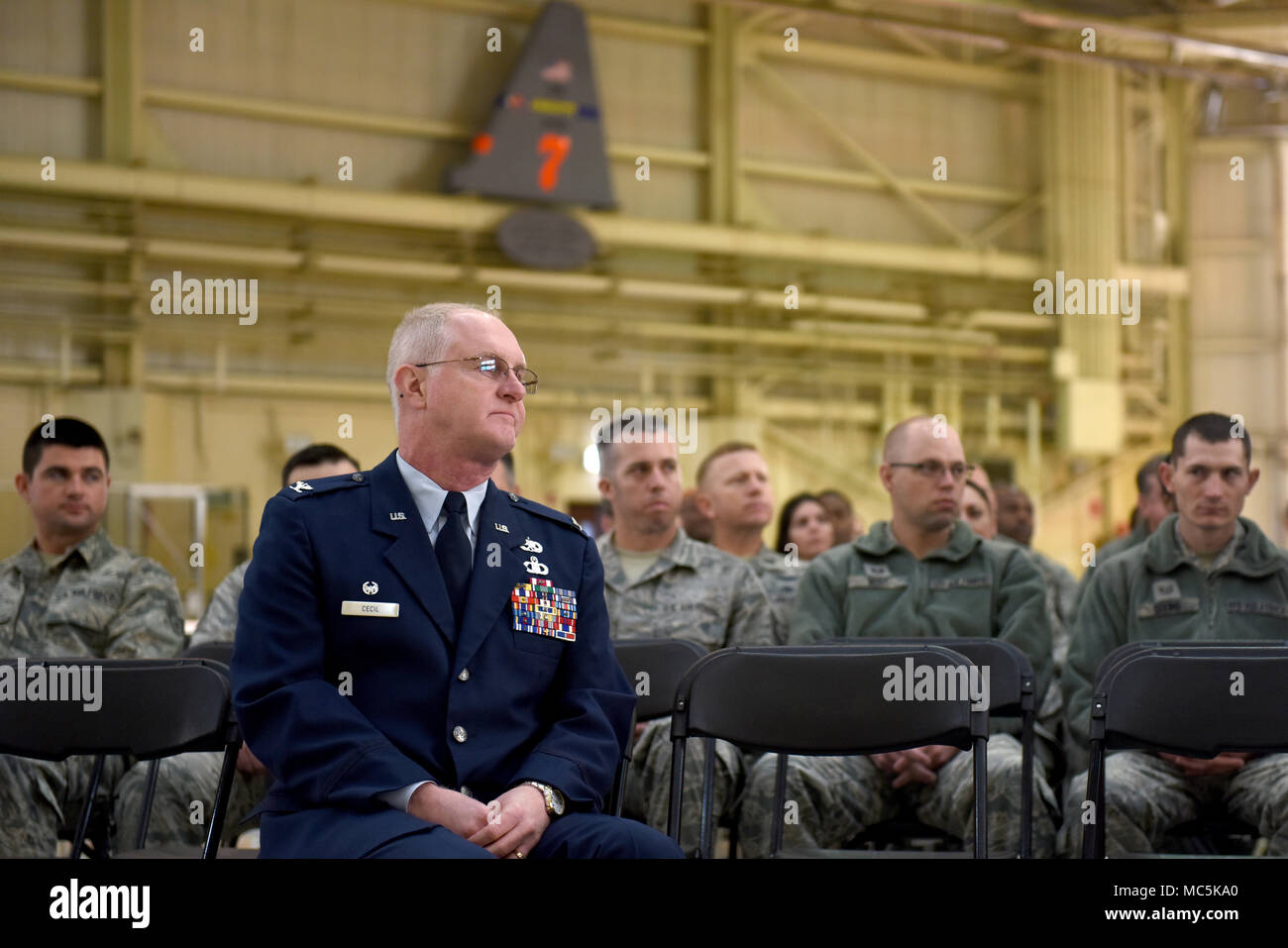 U.S. Air Force Col. Allan Cecil listens as Col. Michael T. Gerock ...