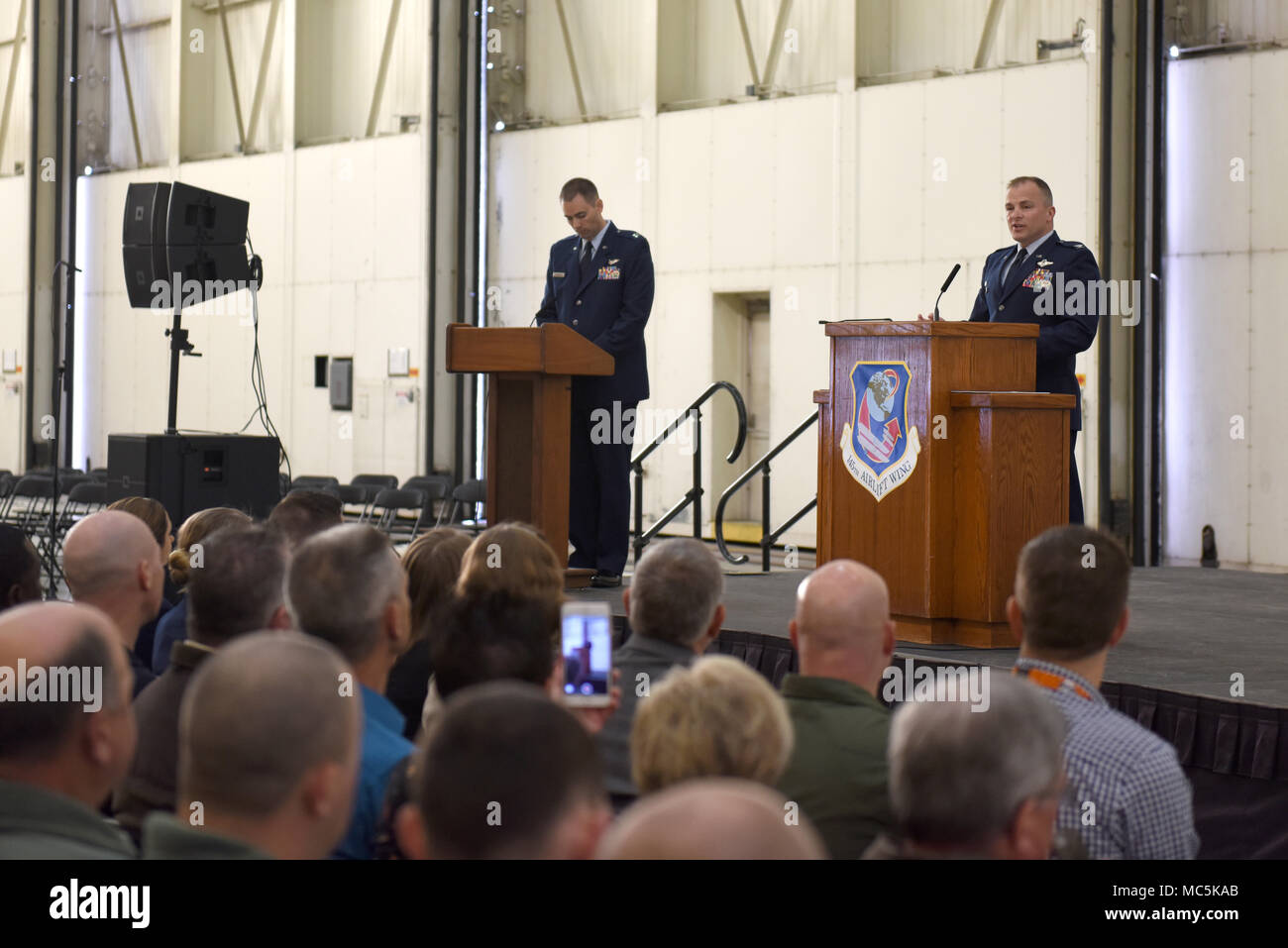 U.S. Air Force Col. Gary Dodge (right) addresses friends and family ...
