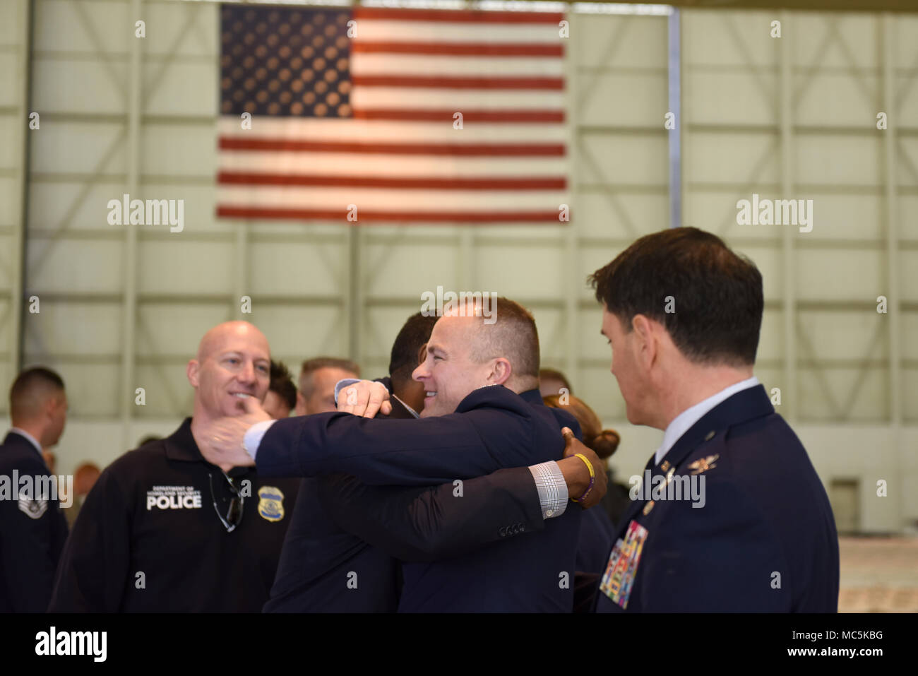 U.S. Air Force Col. Gary Dodge (middle) greets and thanks guests ...