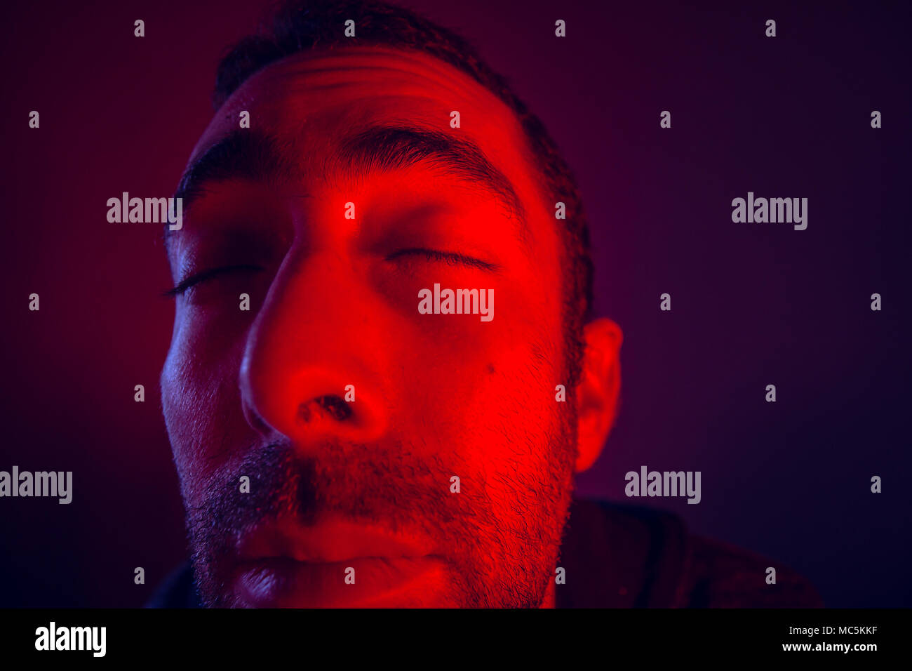 Man with peaceful calm facial expression with close eyes. Close up ...